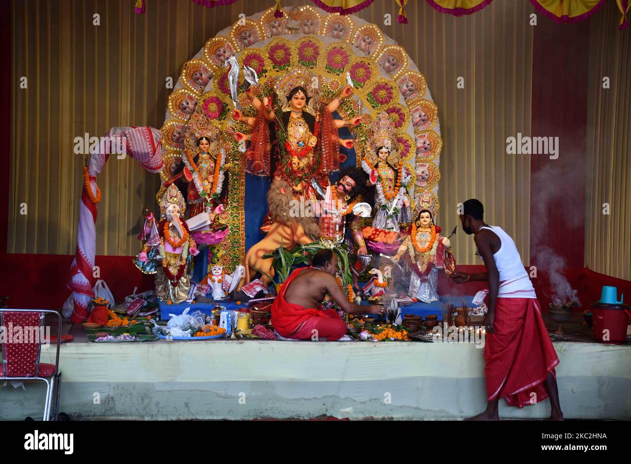 Hindu Priest perform ritual at a community pandal during the Maha ...