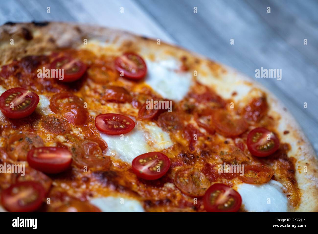 A closeup of a pepperoni pizza on a gray surface Stock Photo - Alamy
