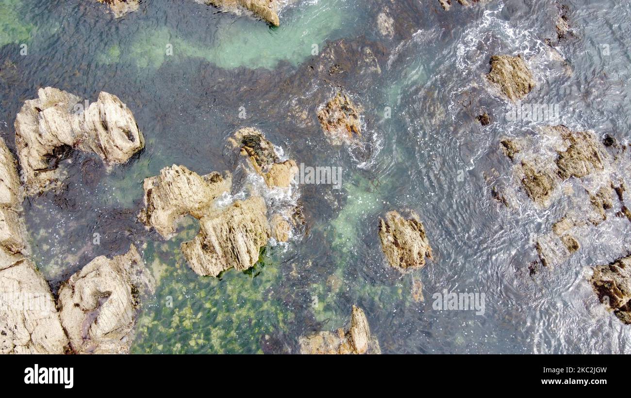 Aerial photo. A lot of boulders in the sea water, top view. Coastal ...