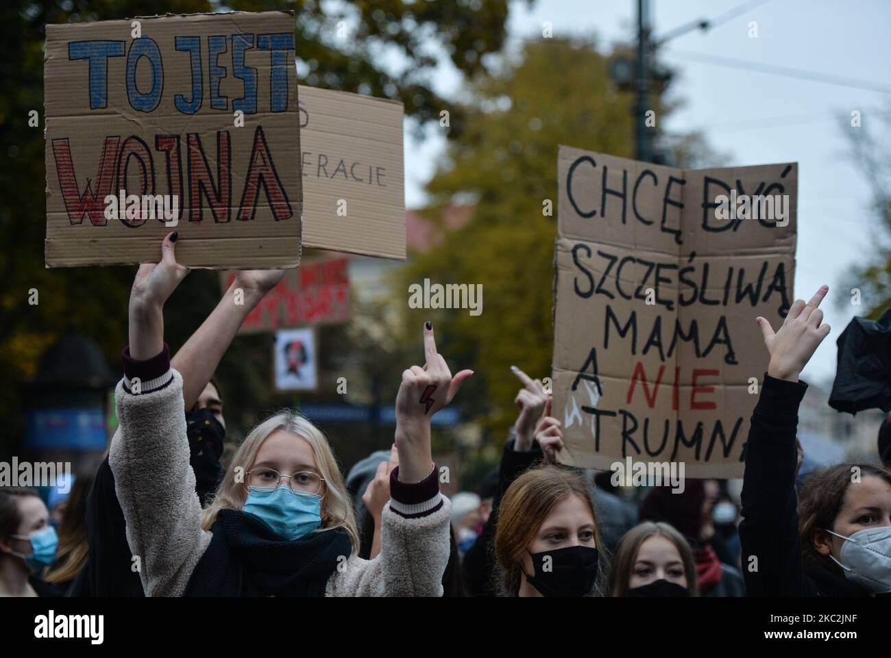 Pro-choice protesters make gestures during the demonstration while ...