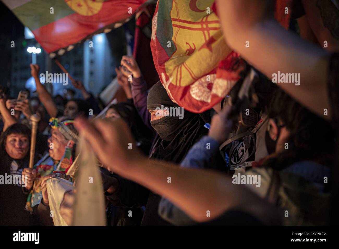 People gather to celebrate the victory of the referendum, in Santiago ...
