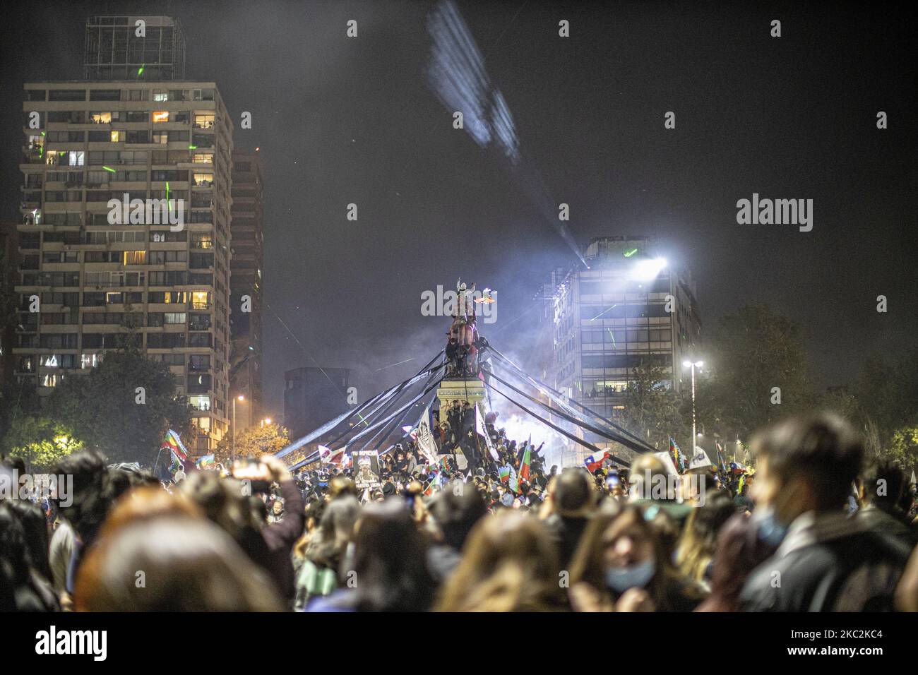 People gather to celebrate the victory of the referendum, in Santiago ...