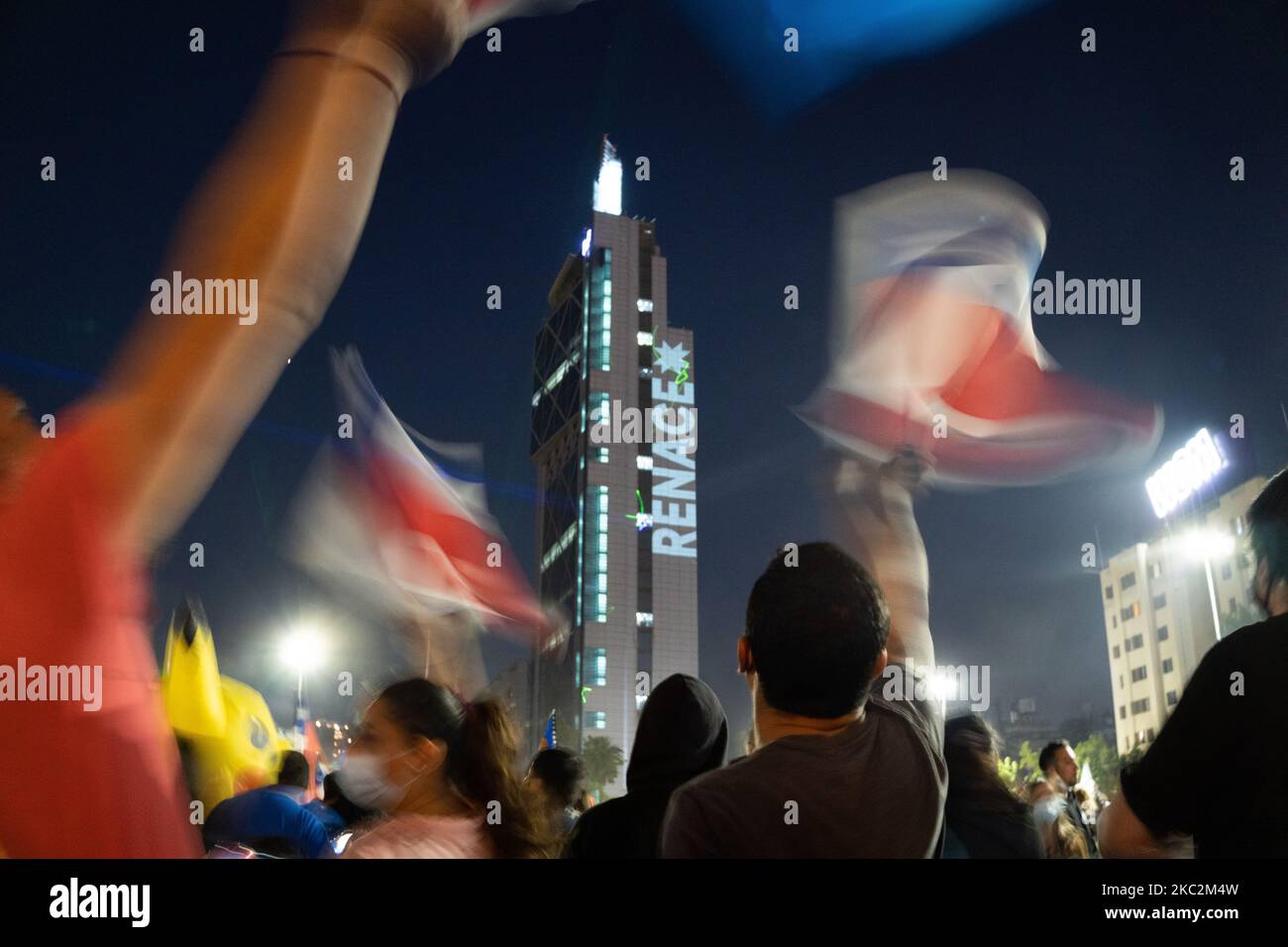 The word ''Renace'' is projected on a building in the midst of the ...