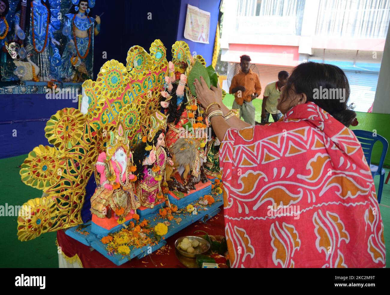 Married Hindu woman performing the last ritual 'Baran' in front of the ...