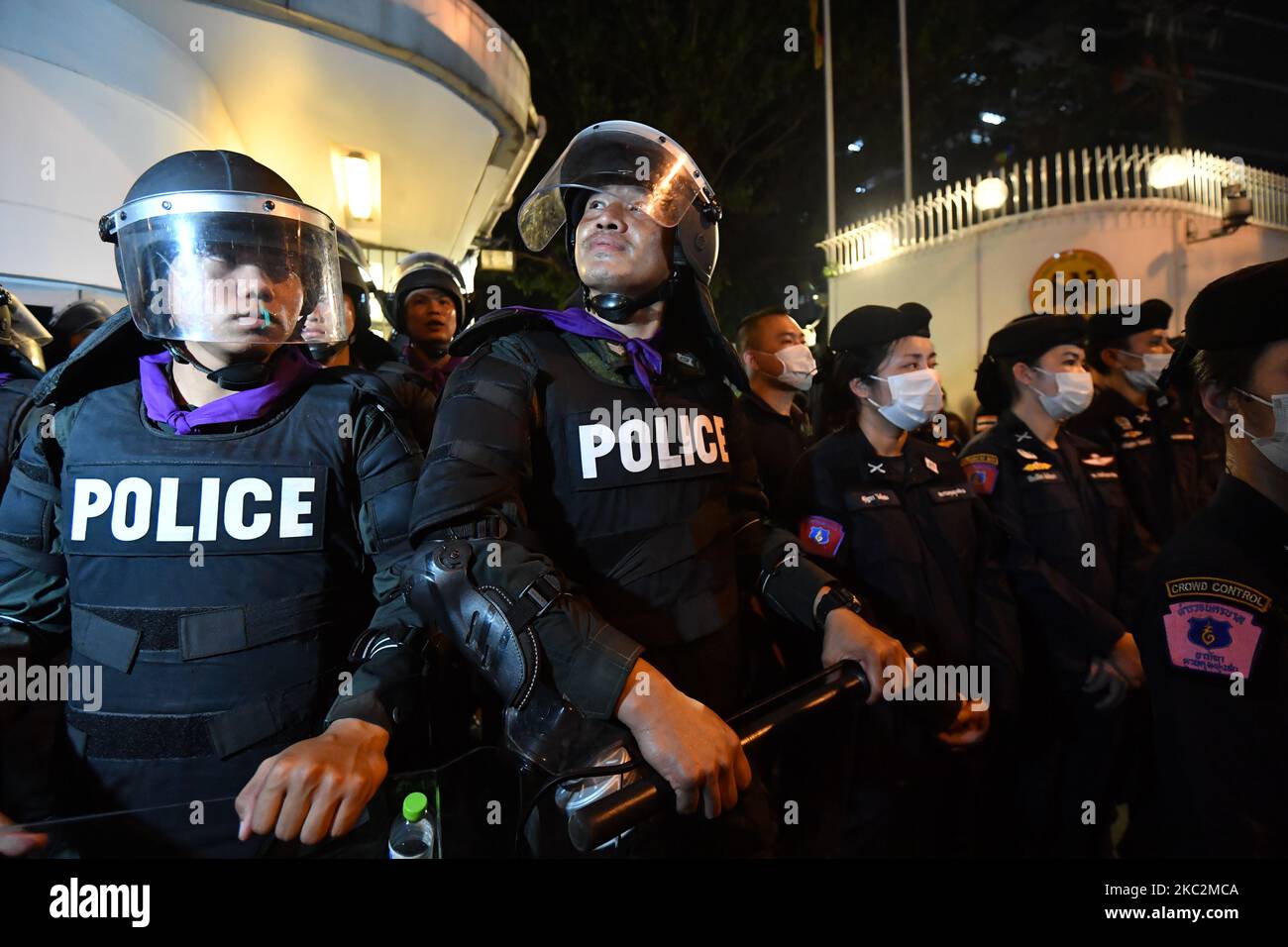Thai riot police stand guard outside German embassy in Bangkok on ...