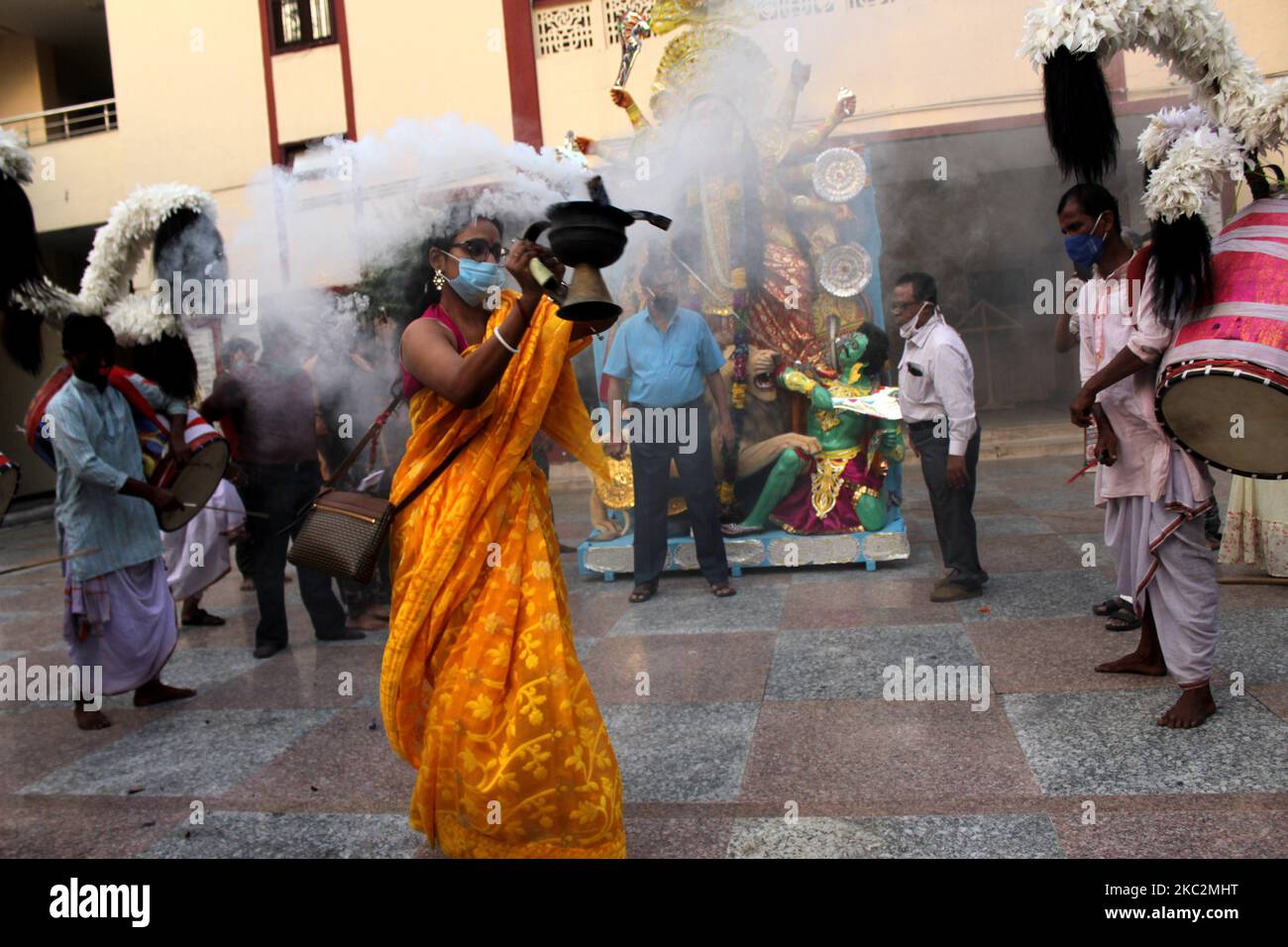 A devotee performs 'Dhunuchi Naach' which is performed to thank the ...