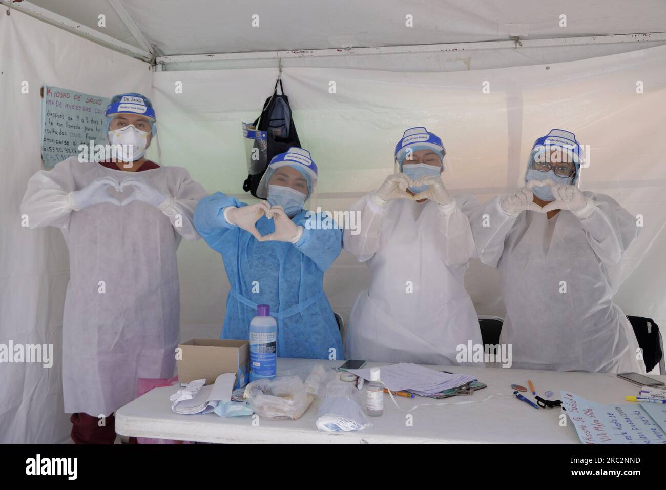Medical personnel say goodbye making a heart with their hands at the ...