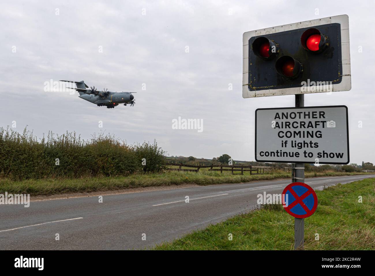 Traffic lights flash as a Royal Air Force Airbus A400M approaches RAF ...
