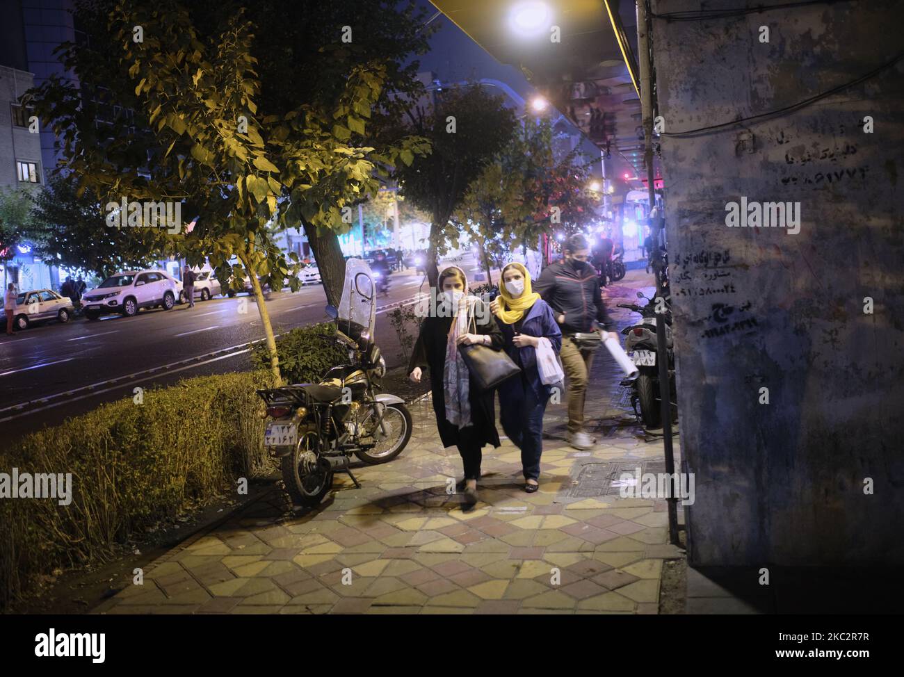 Two Iranian women wearing protective face masks to prevent themselves ...
