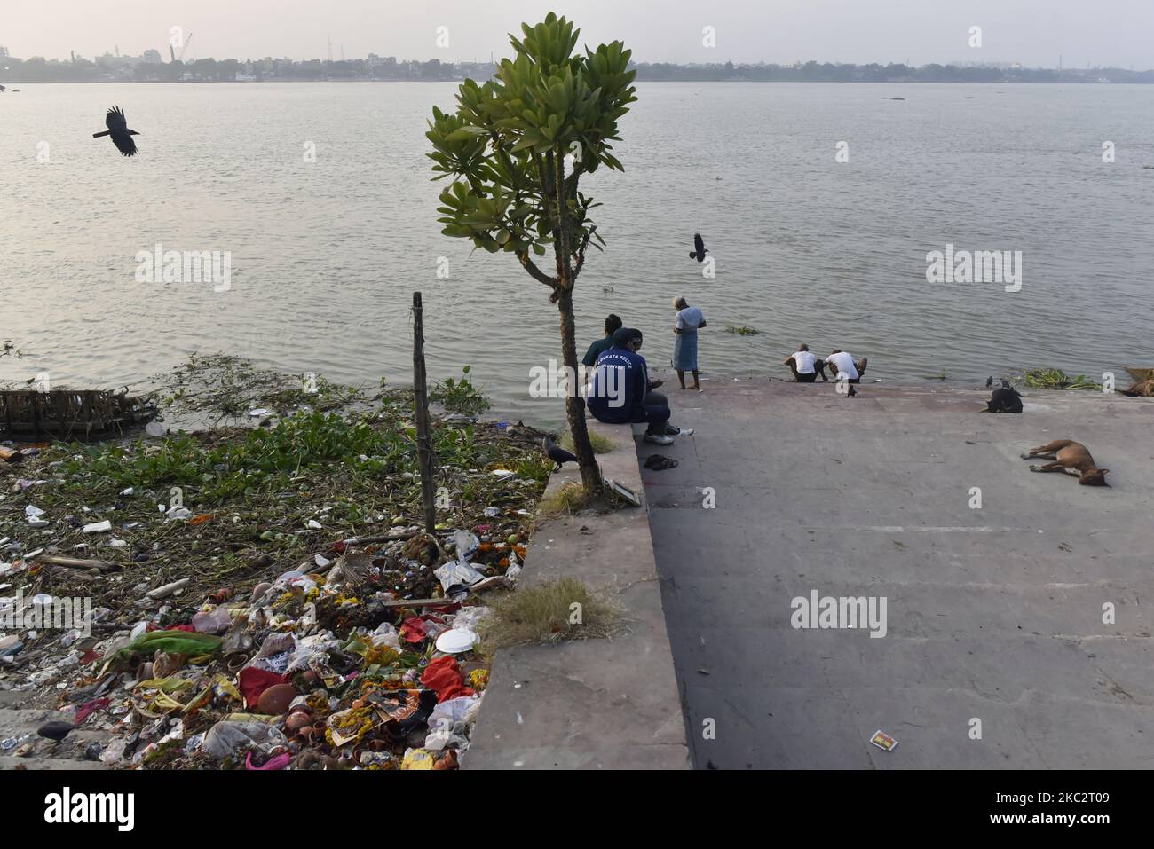 Garbage can be seen on one side of a ghat of the river Ganga during the ...