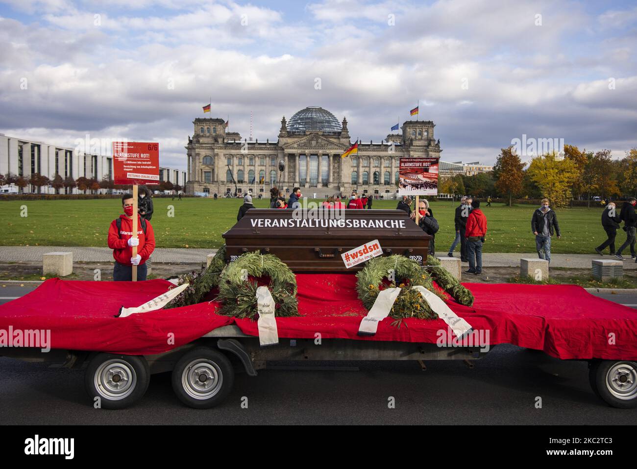 A coffin carrying the incription 'Event industry' passes in front of ...