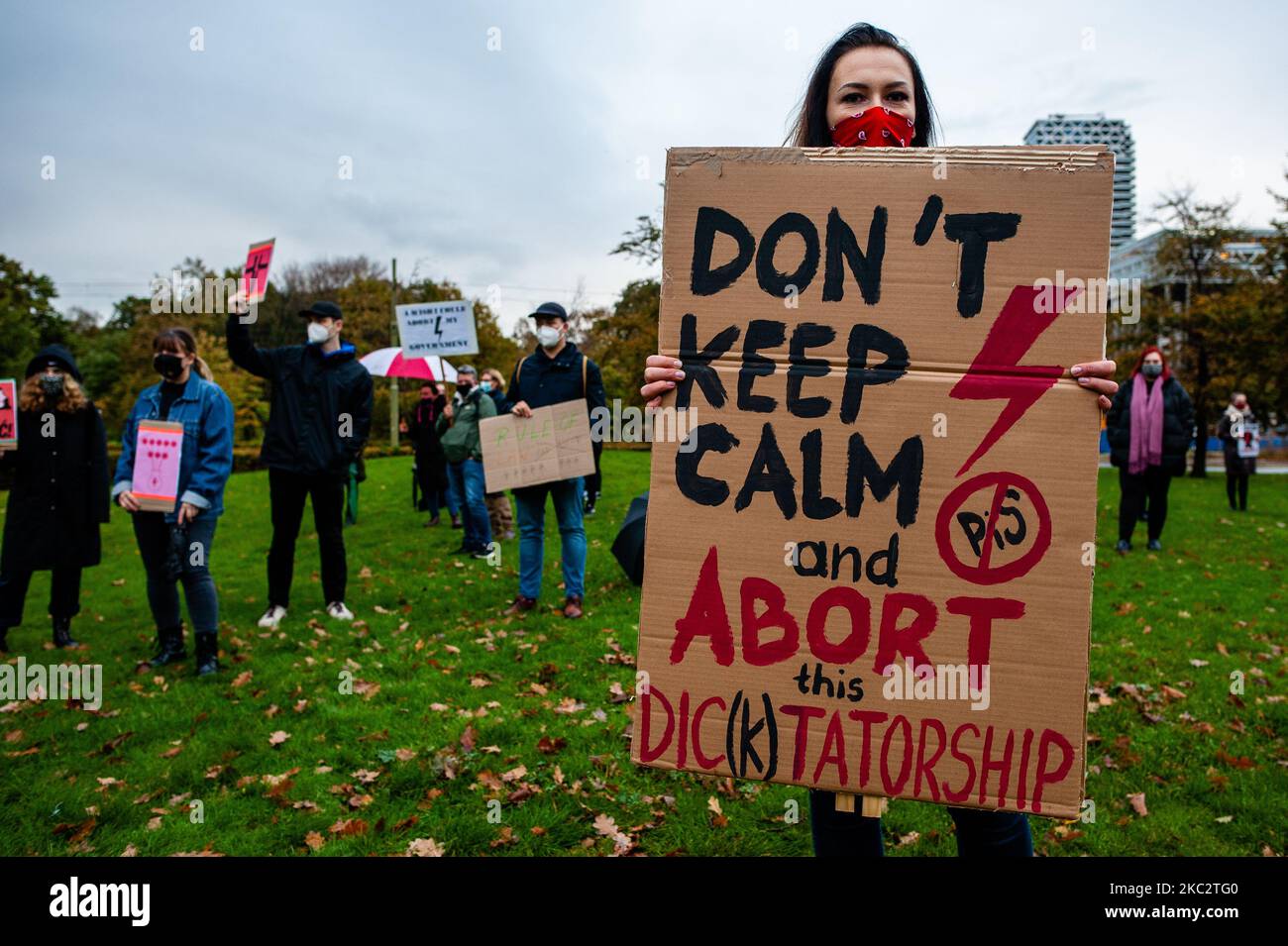 A woman is holding a big placard, during the protest against the ...