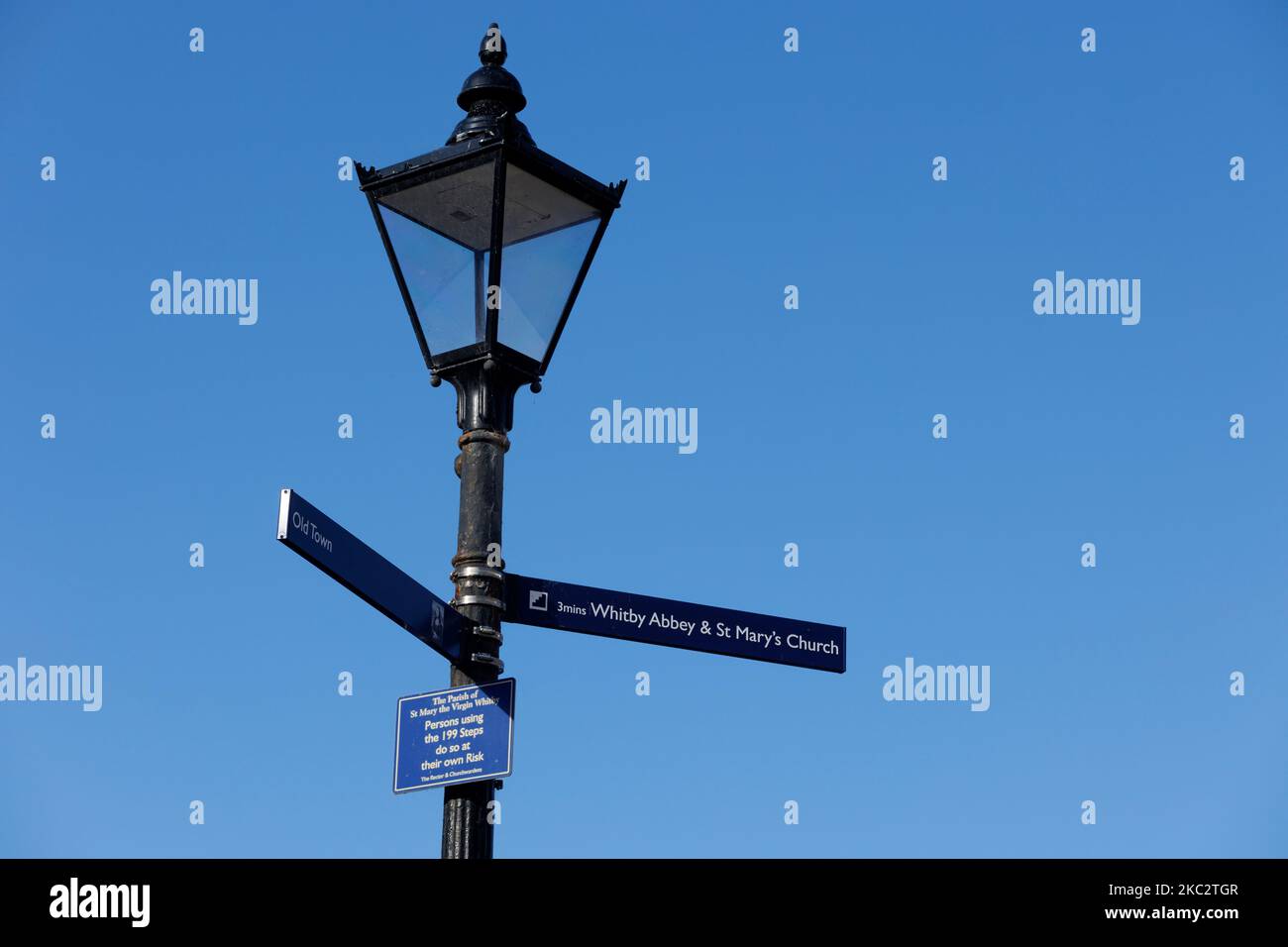 Typical directional signpost and lamp Whitby North Yorkshire England ...