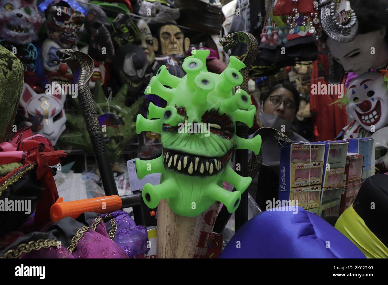 Sale of costumes and masks of the coronavirus molecule in the corridors ...
