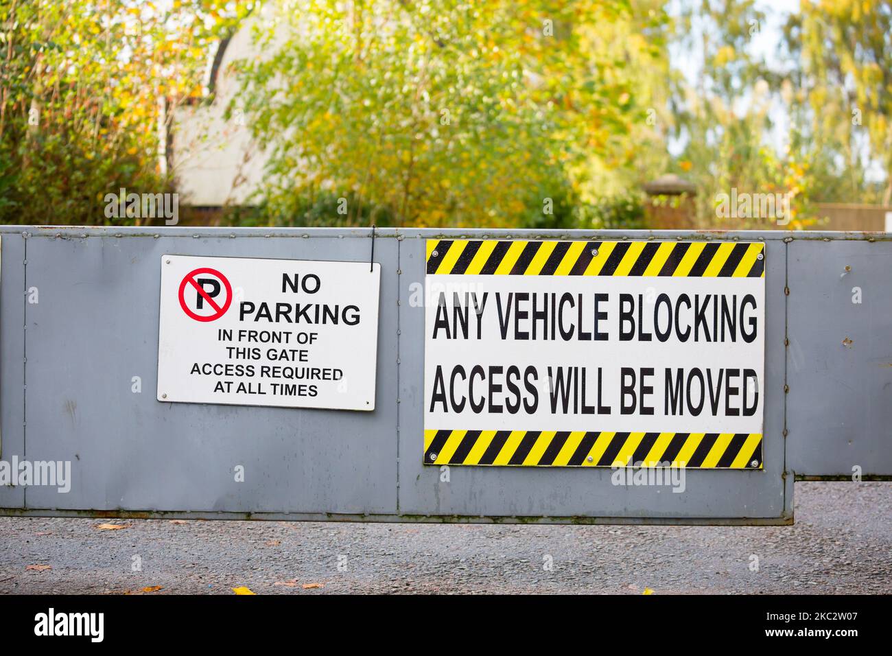 Outdoor sign: No parking in front of this gate, Access required at all ...