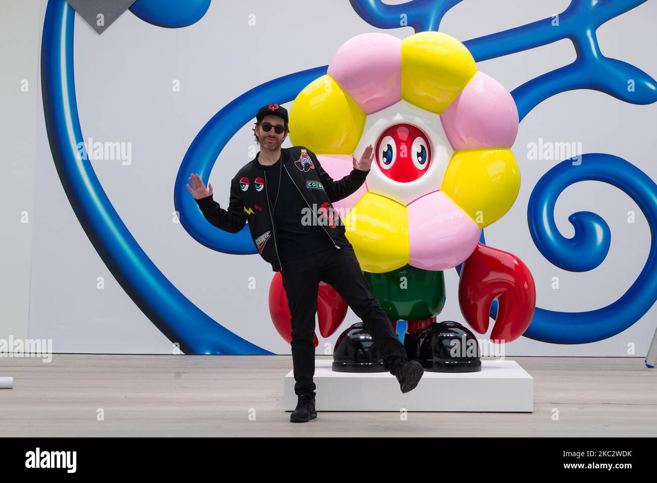 Pop artist Philip Colbert poses next to 'Lobster Flower' during the ...