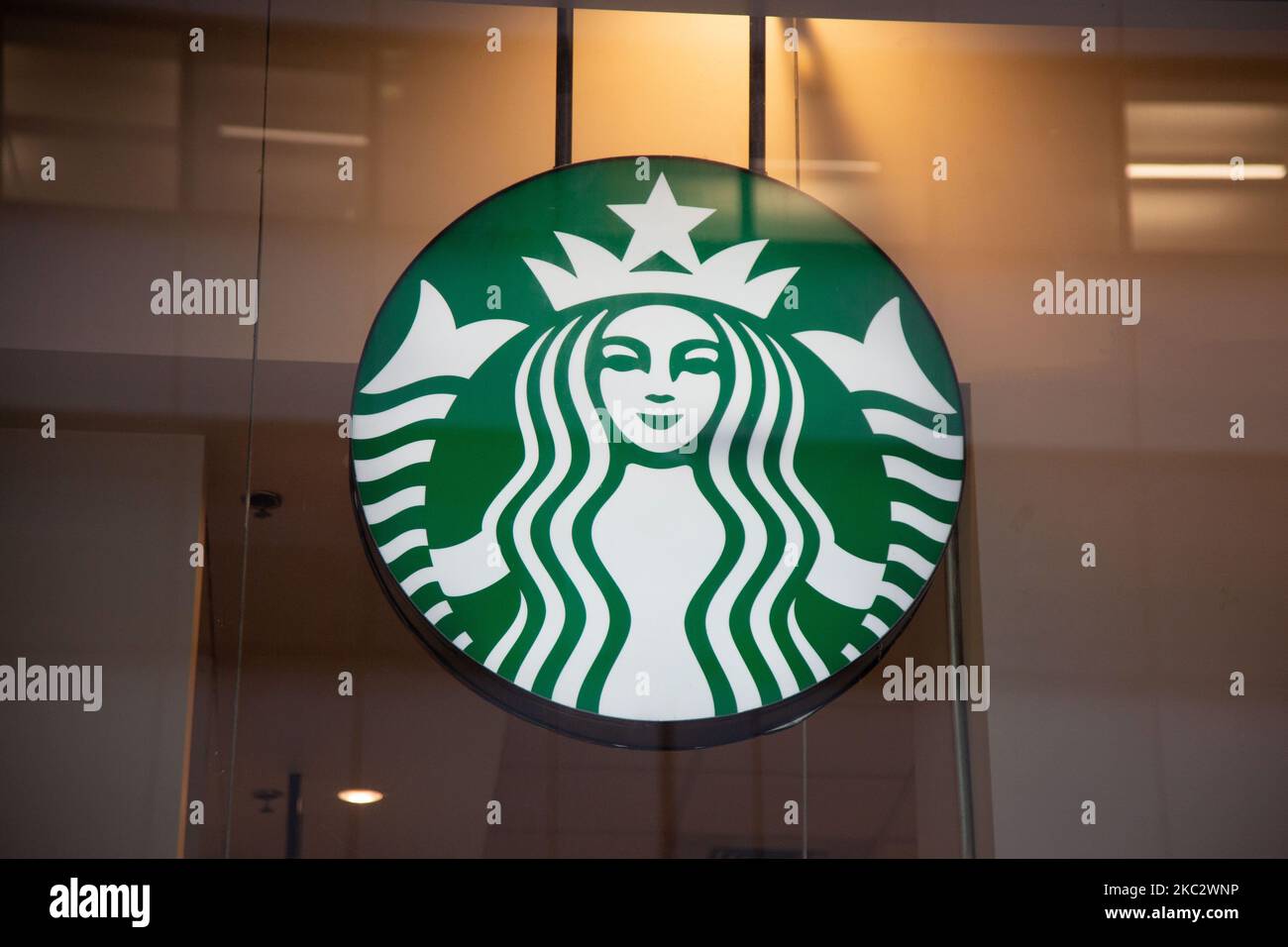 Closeup of an illuminated green Starbuck mermaid or siren from Greek ...