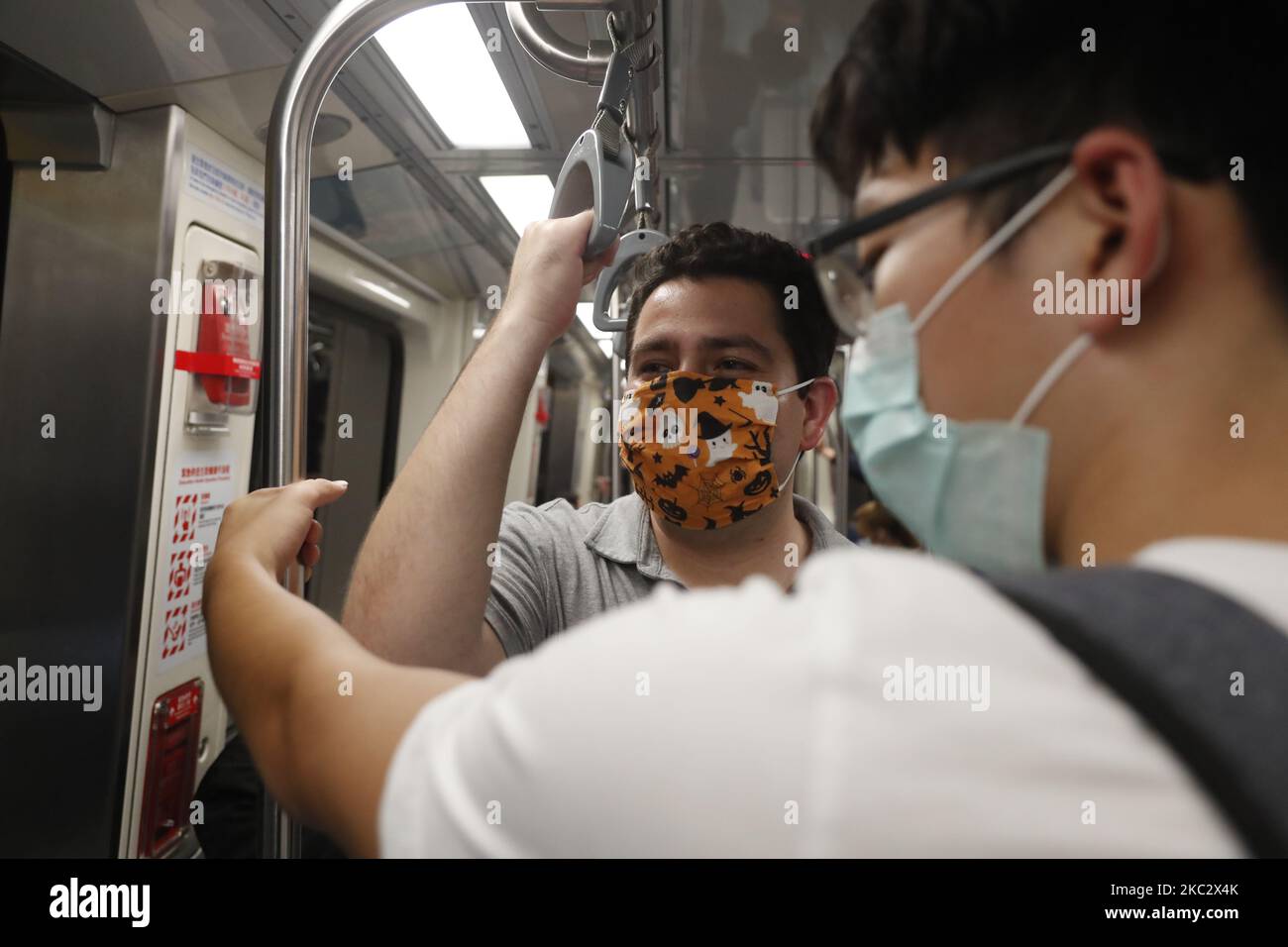 Passengers wear surgical masks during their rides on public transports ...