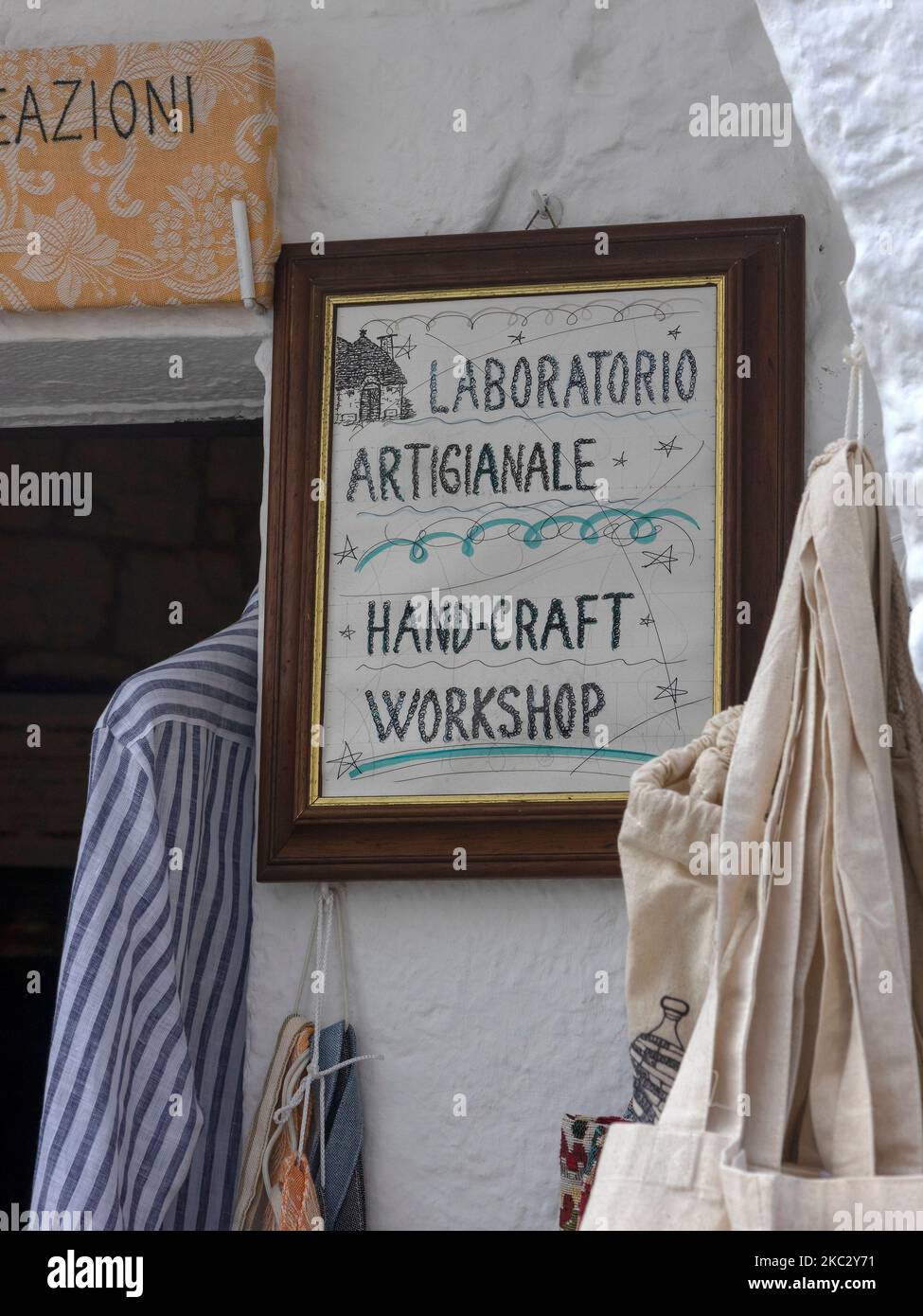 ALBEROBELLO, ITALY - OCTOBER 15, 2022: Rustic sign outside gift shop ...