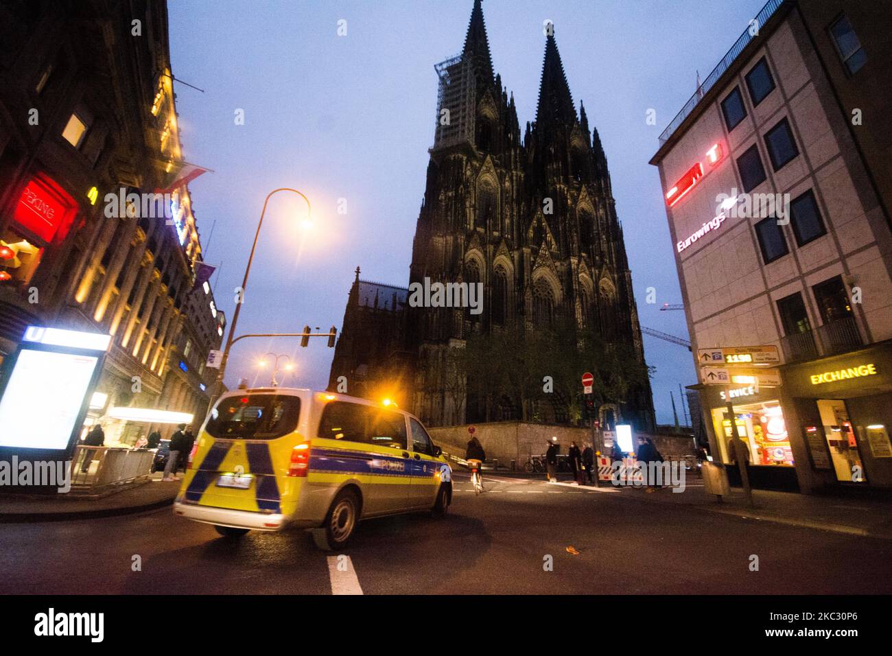 police car is seen patroling in front of dom cathedral in Cologne ...