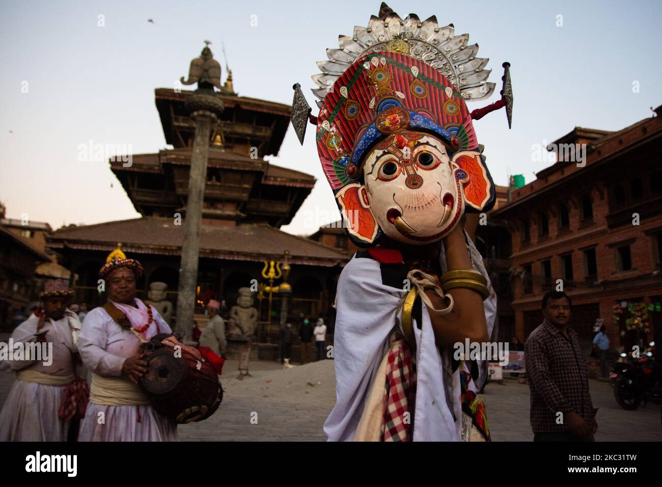 A man attired as deity performs traditional mask dance during Navadurga ...