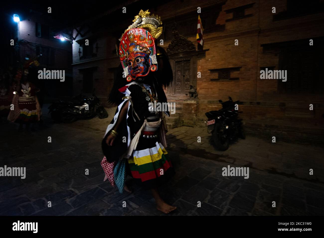 A man attired as deity performs traditional mask dance during Navadurga ...