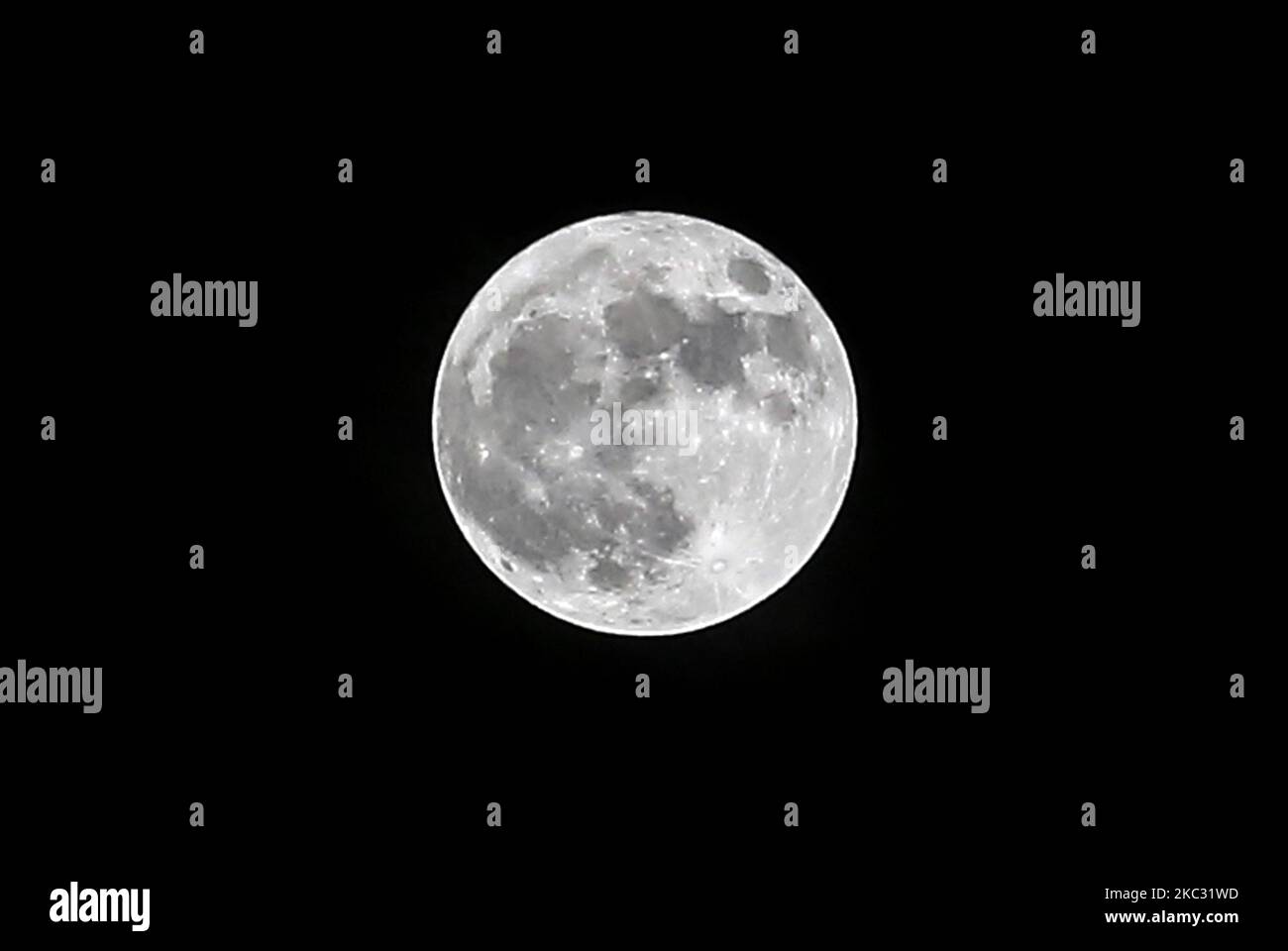 A Blue moon, the second full moon of a calendar month, rises above Gaza ...