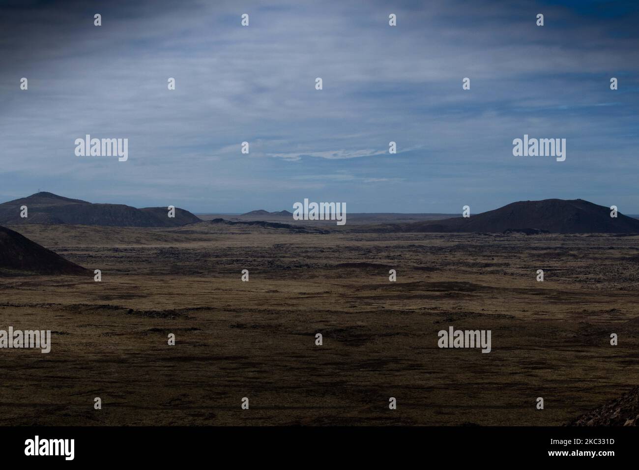 The view of a gloomy valley with small hills Stock Photo - Alamy