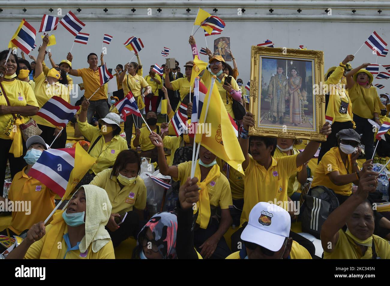 Royalist supporters wearing yellow attire take part in a rally outside ...