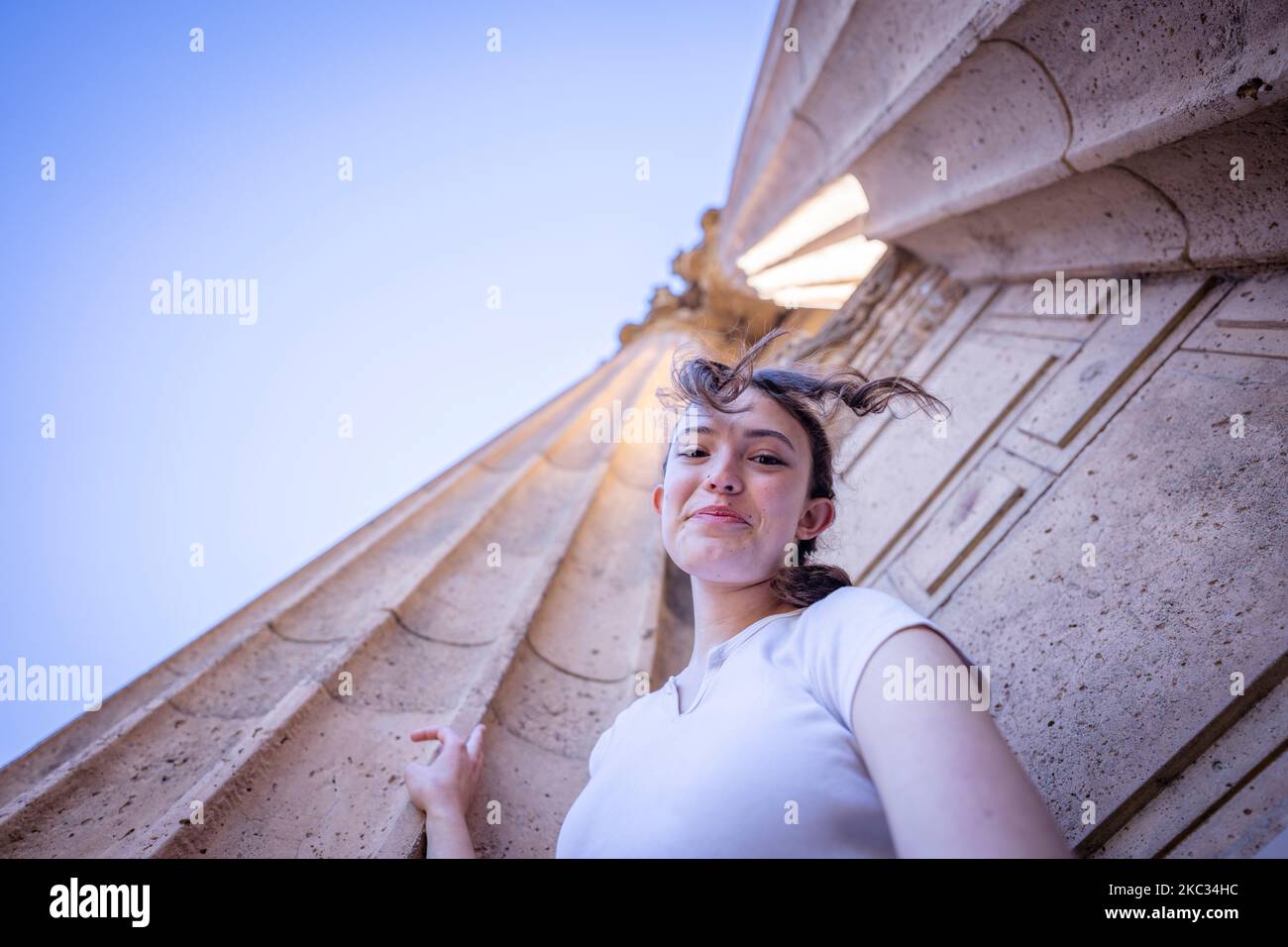 Girl between two columns hi-res stock photography and images - Alamy