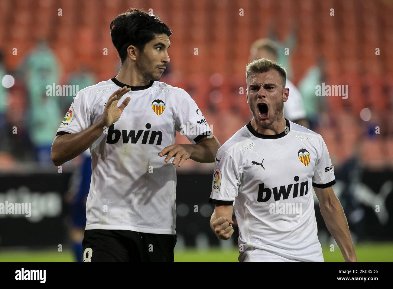 Carlos Soler (L) of Valencia CF celebrate after scoring the 2-2 goal ...