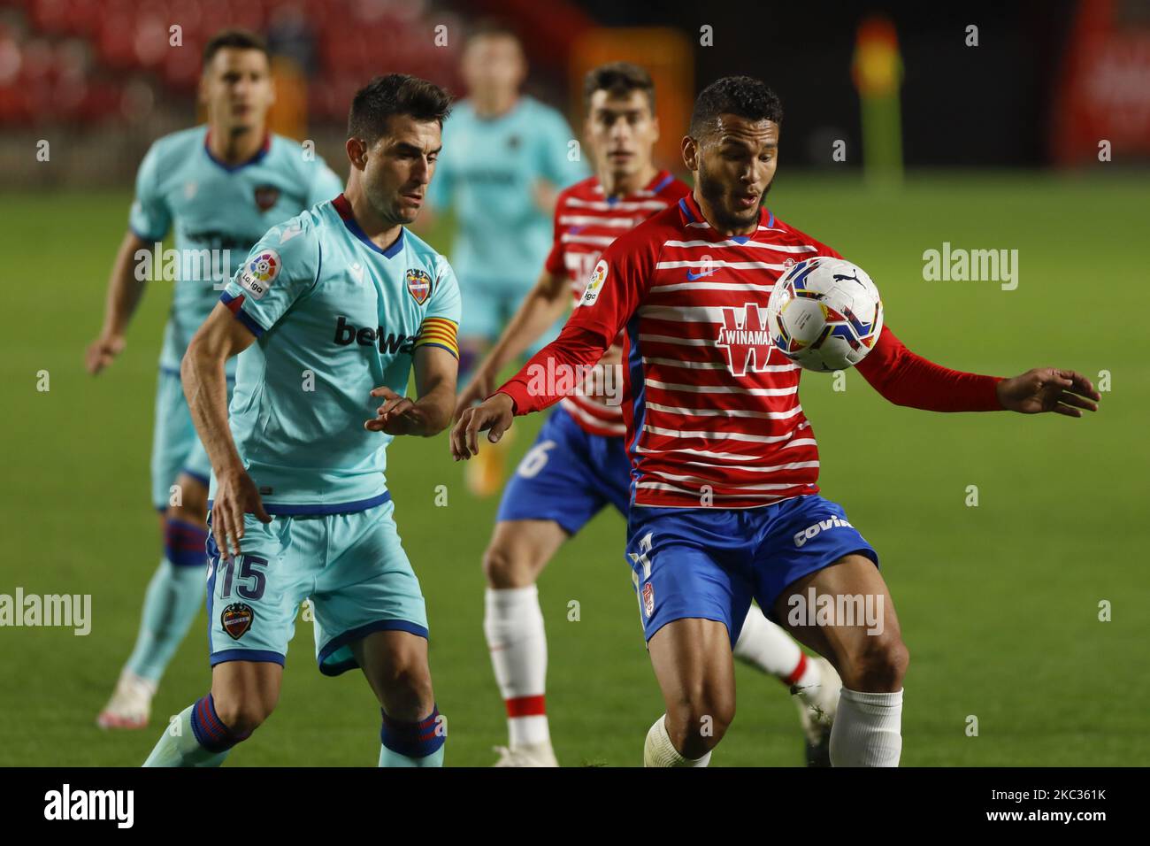 Luis Suarez, of Granada CF and Sergio Postigo, of Levante during the La ...