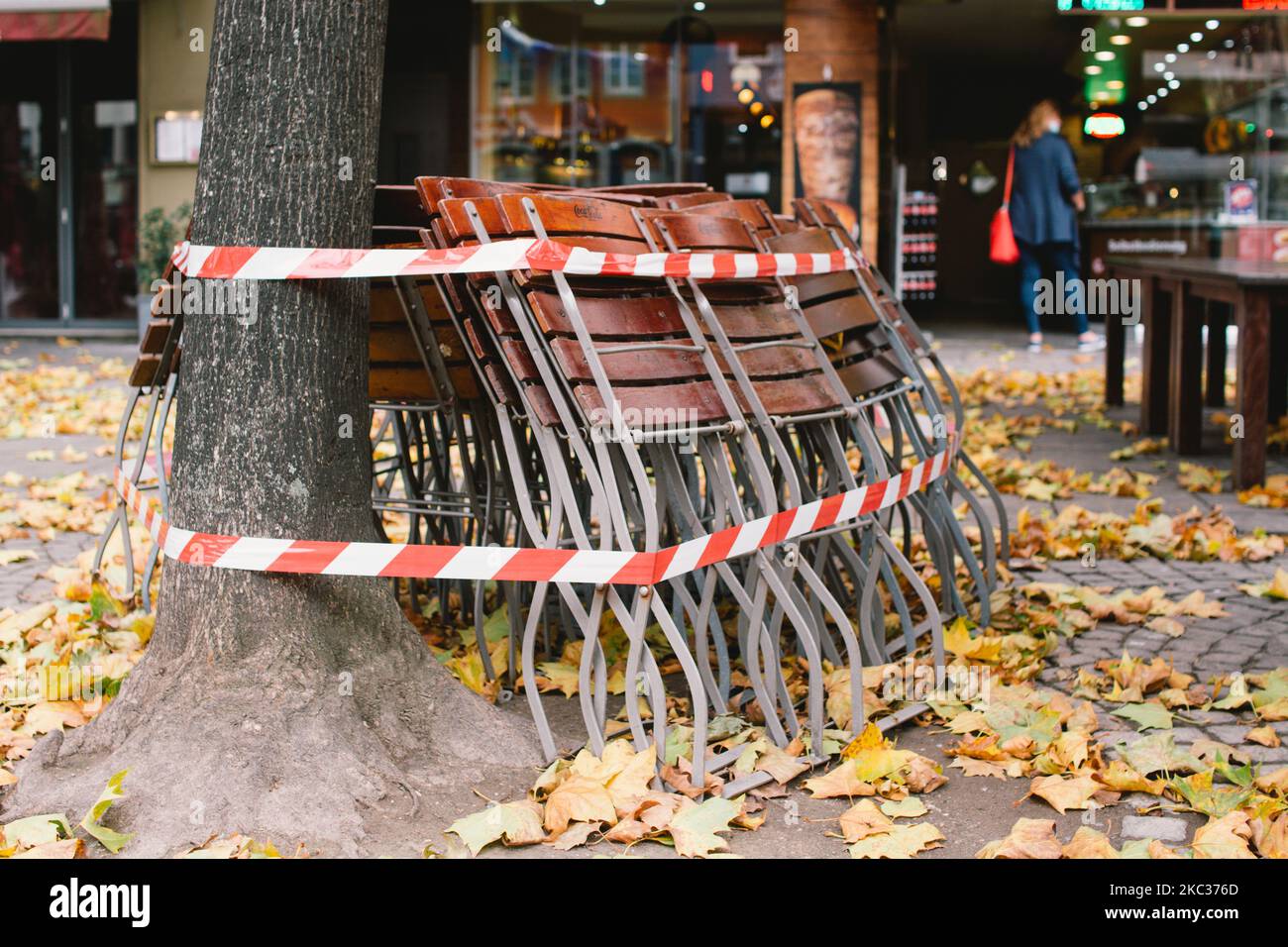 chairs are set together in front of a restaurant as lock down lite ...