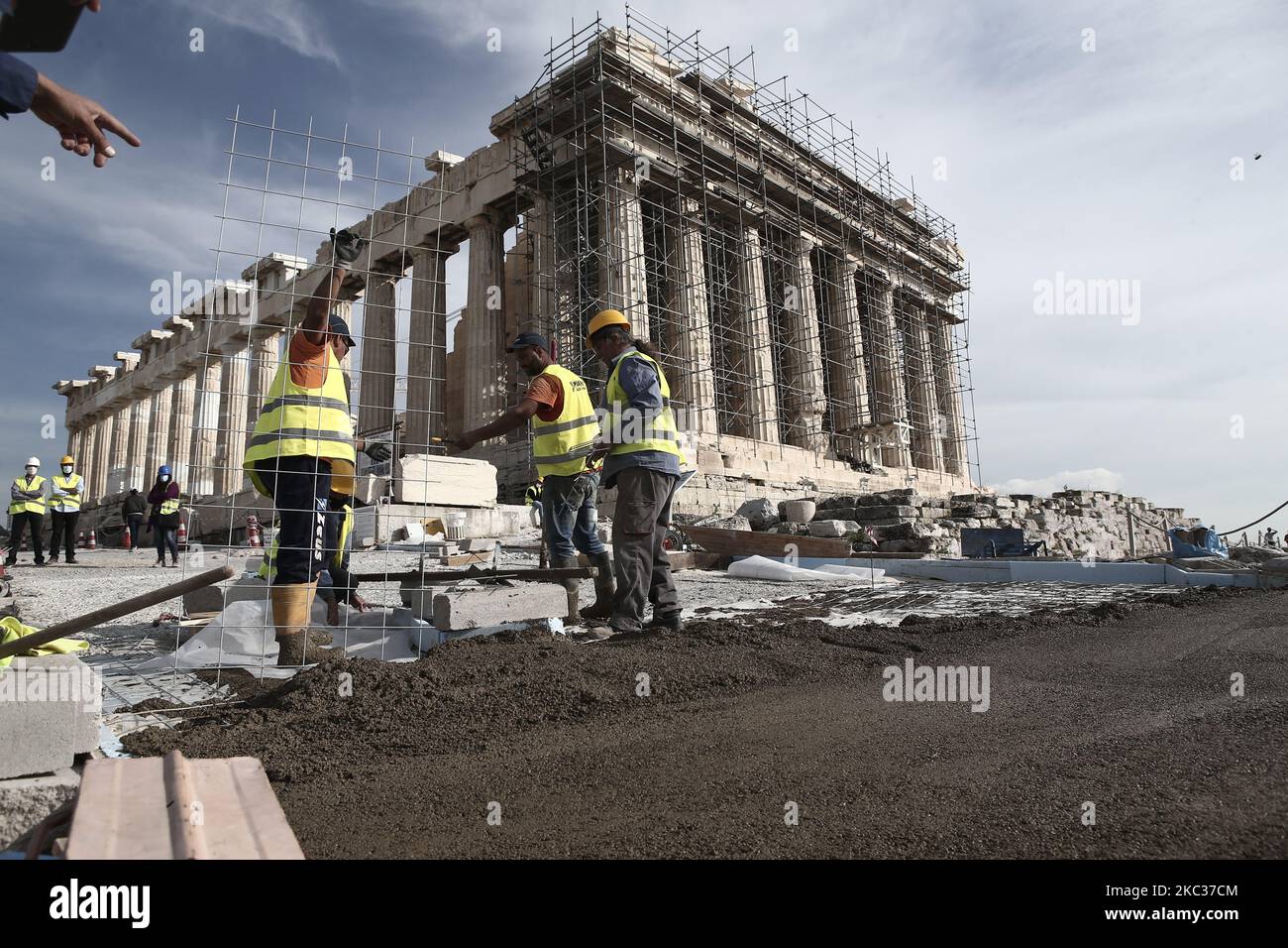 Workers create a path to facilitate access to the monuments of the ...