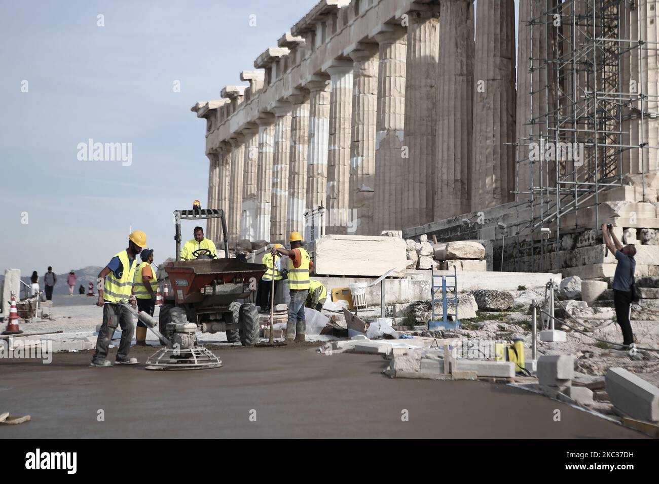 Workers create a path to facilitate access to the monuments of the ...