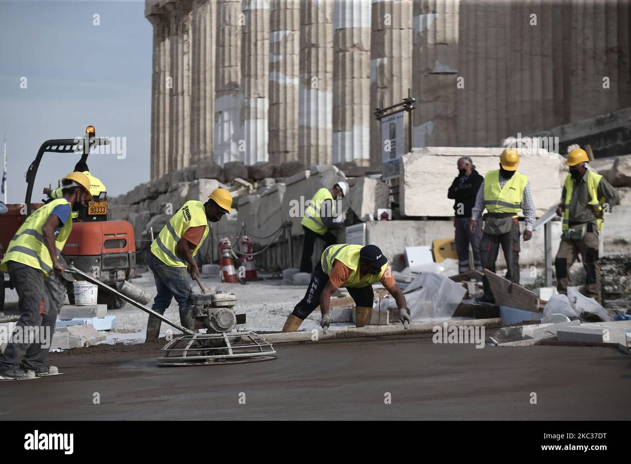 Workers create a path to facilitate access to the monuments of the ...