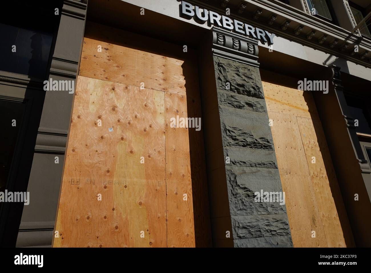 Workers boarding up a Burberry Store in anticipation of unrest related ...