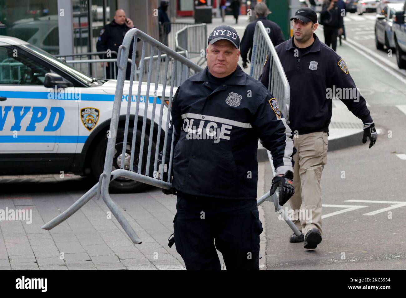 NYPD Officials are seen piling metal barricades to block roads in ...