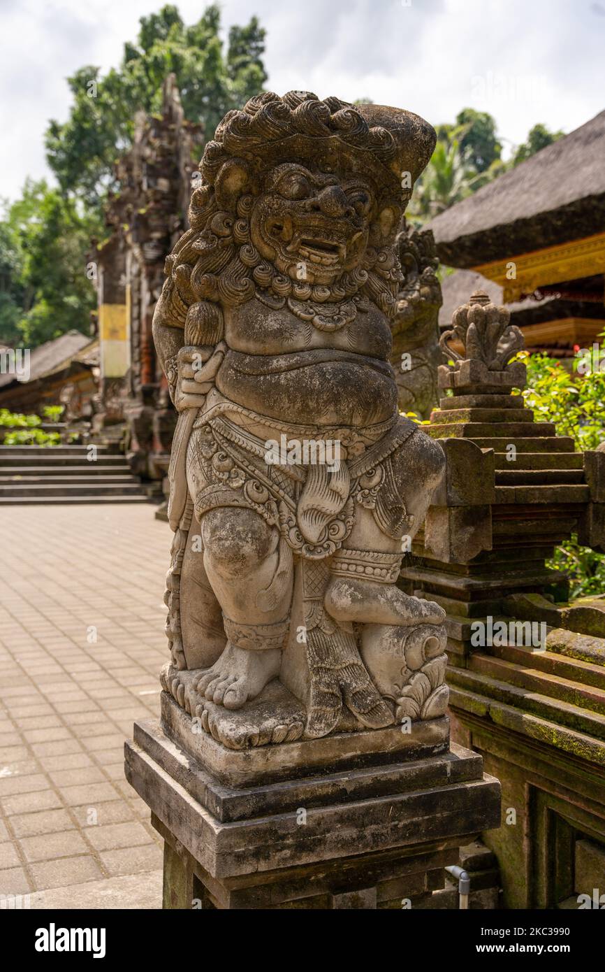 A vertical closeup of ancient statue in a temple in Bali, Indonesia ...