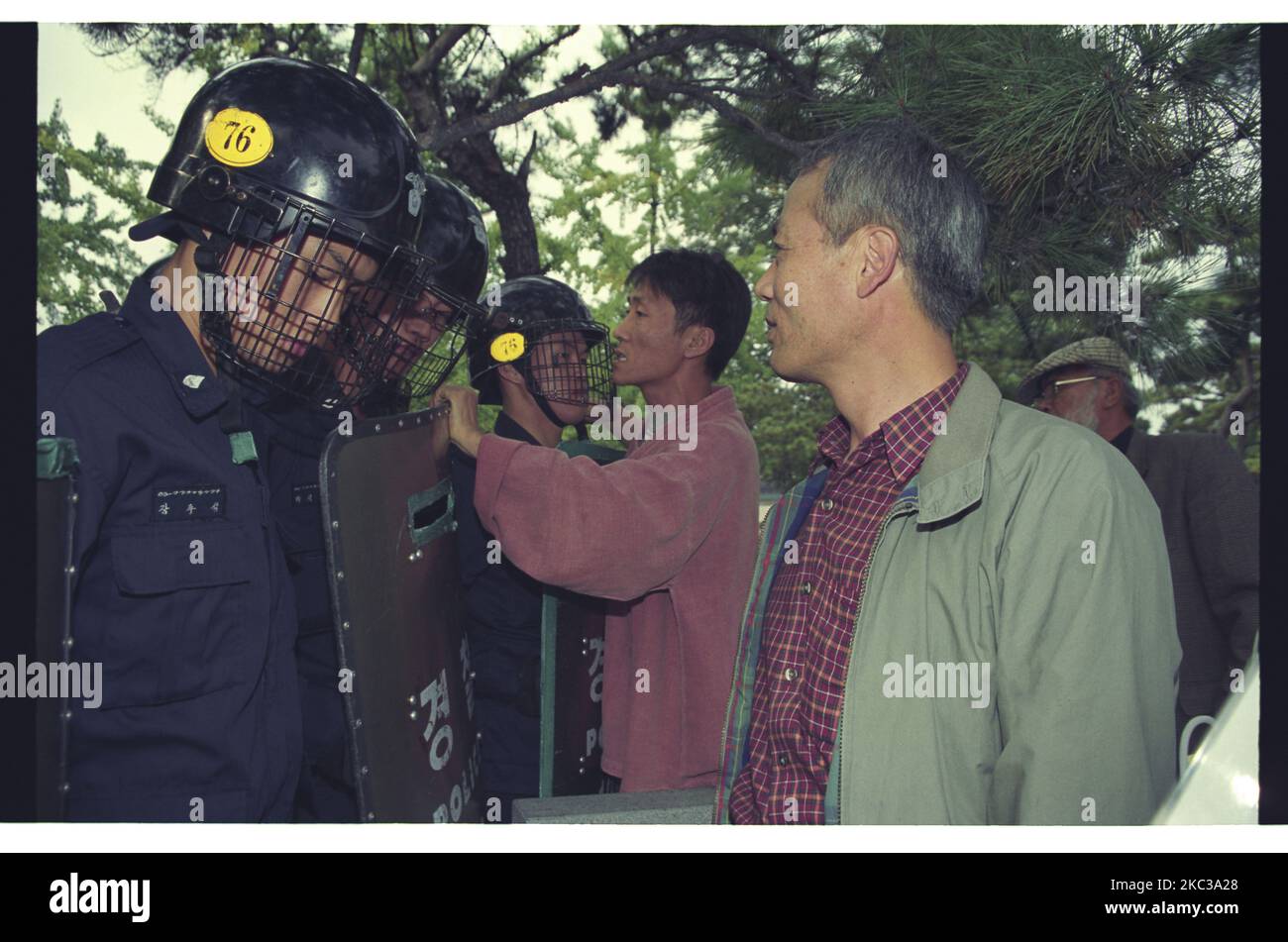 This Pictures taken date is 2003. A Protesters hold pickets and shout ...