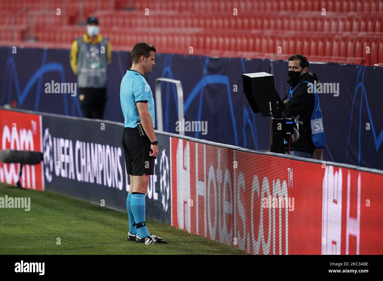 Referee watches the VAR screen during the UEFA Champions League Group E ...