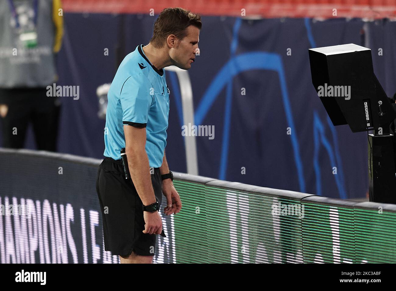 Referee watches the VAR screen during the UEFA Champions League Group E ...