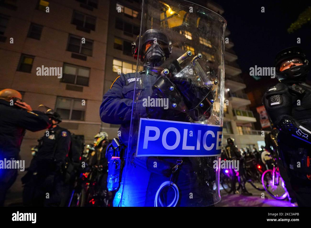 NYPD riot police stands in formation to disperse protestors on November ...
