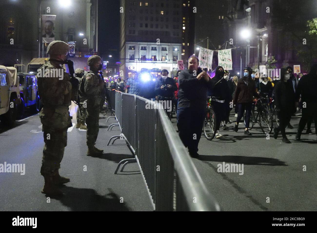 National Guardsmen look on as demonstrators demand to Count Every Vote ...