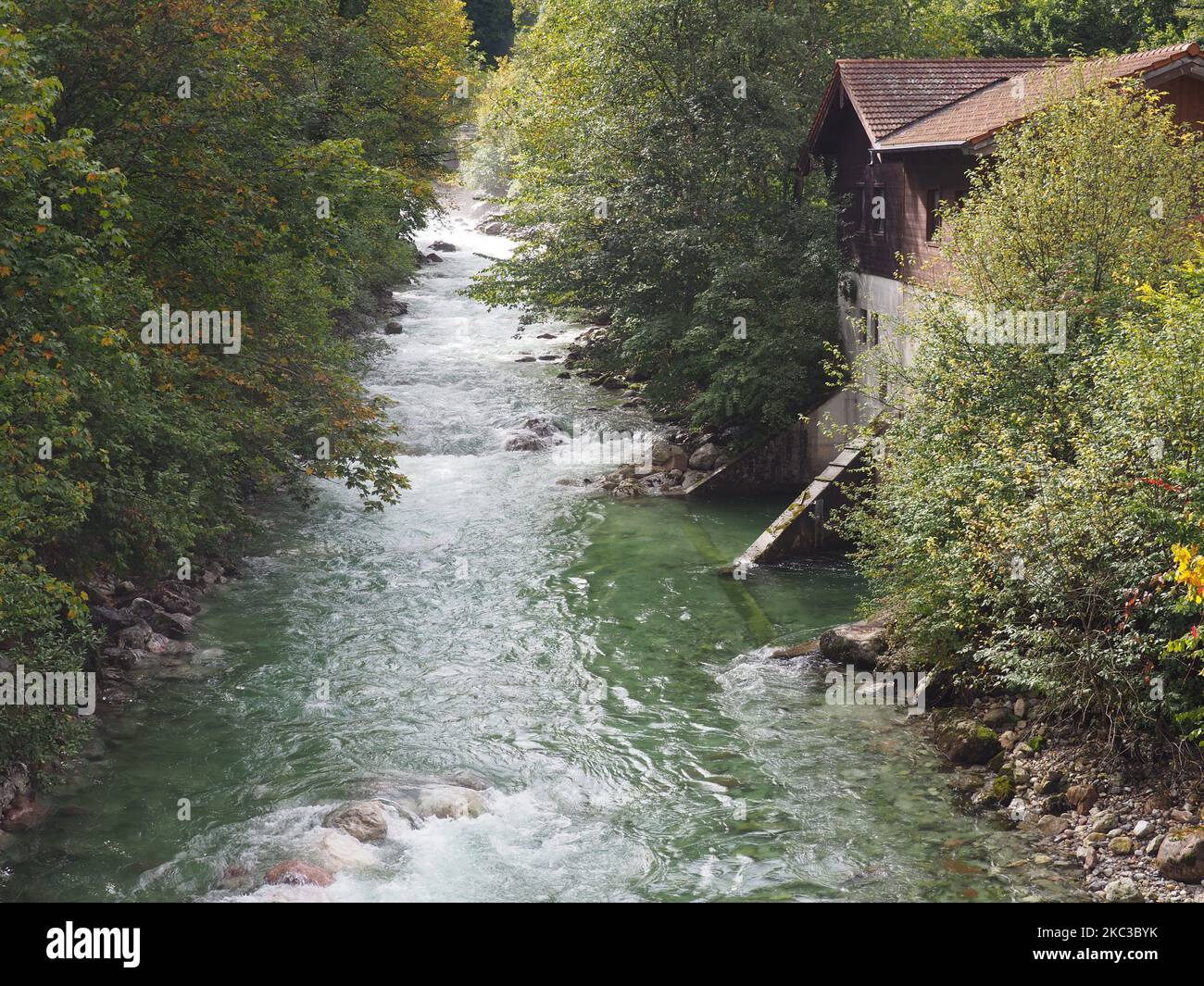 An ancient water mill by a mountain stream in Bavaria, Germany Stock ...
