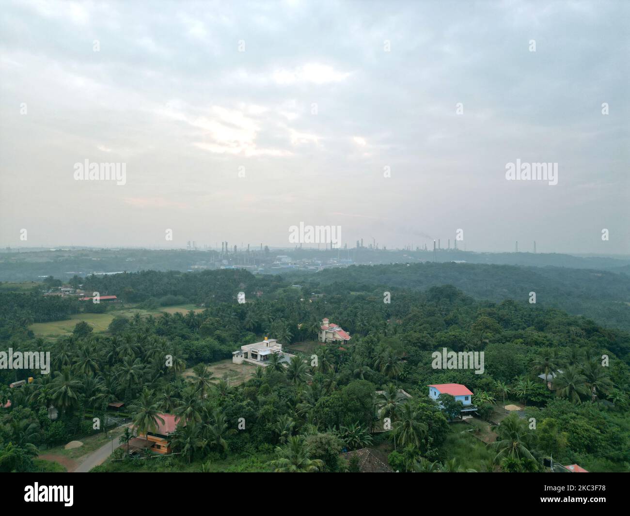 An aerial view of houses surrounded by greenery in Mangalore and ...