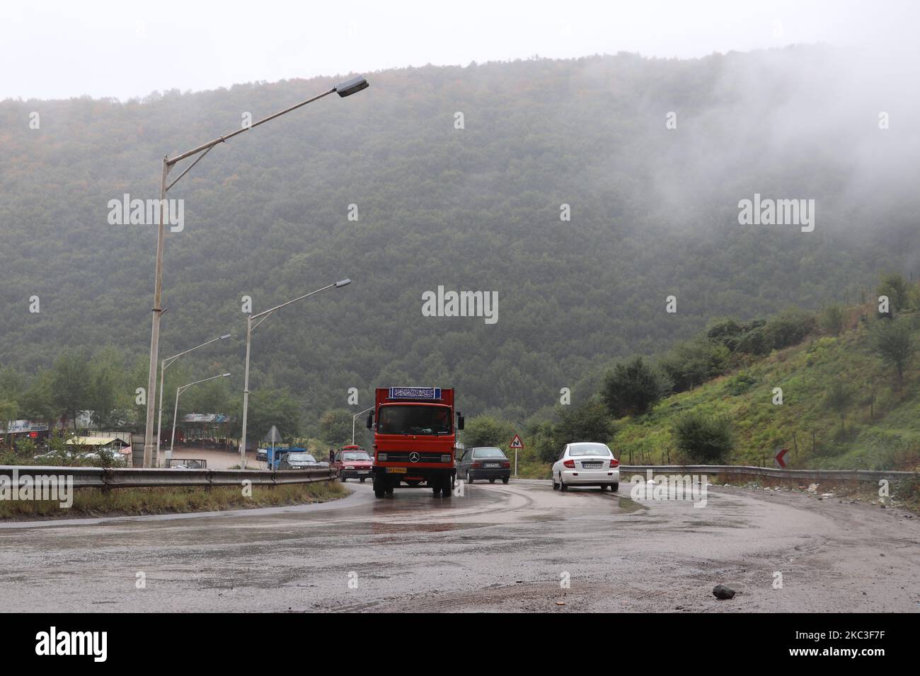 An asphalt road connecting Ardebil to Astara with cars on it in Iran ...
