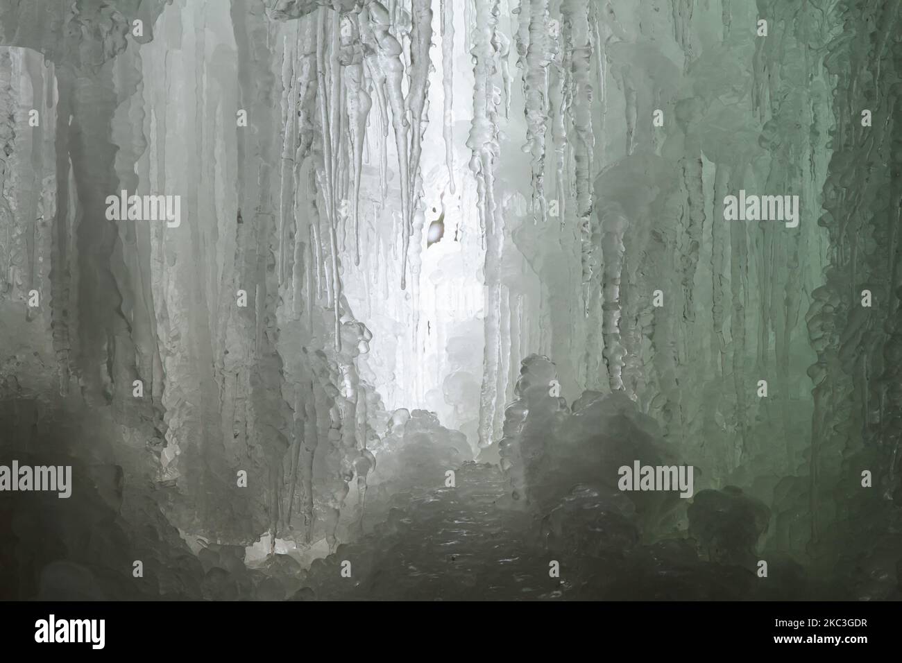 A beautiful ice curtain under a frozen waterfall Stock Photo - Alamy