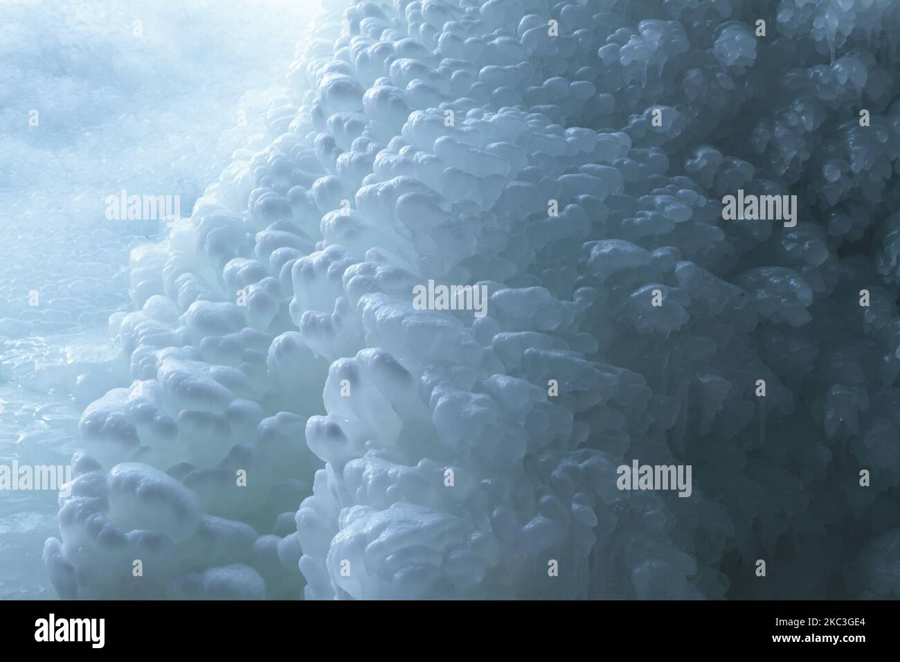 A beautiful ice blob formation under a frozen waterfall Stock Photo - Alamy