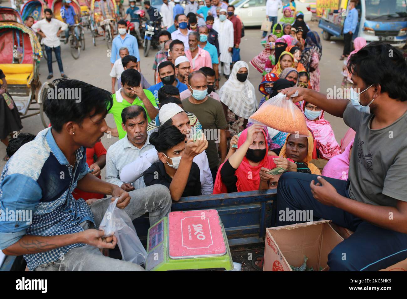 People buy subsidized food in Dhaka, Bangladesh on November 8, 2020 ...